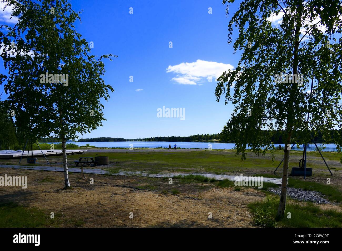 Kalix, Sweden Two senior women with walkers on the beach of the Kalix ...
