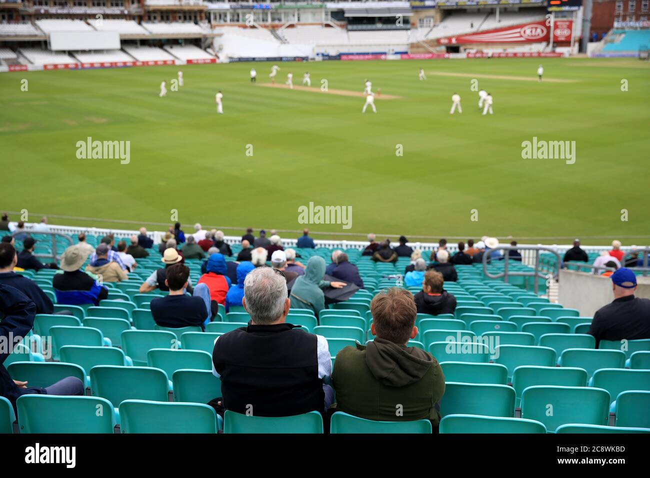 cricket fans watch from the stands during the friendly match at the Kia ...