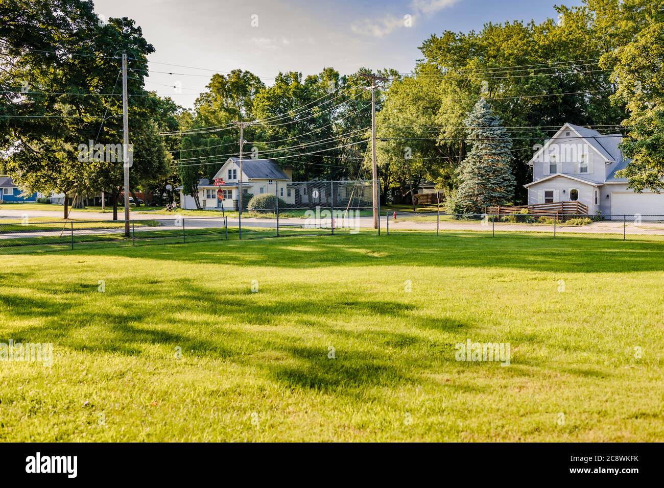 small park with a baseball diamond that has a grass infield Stock Photo ...