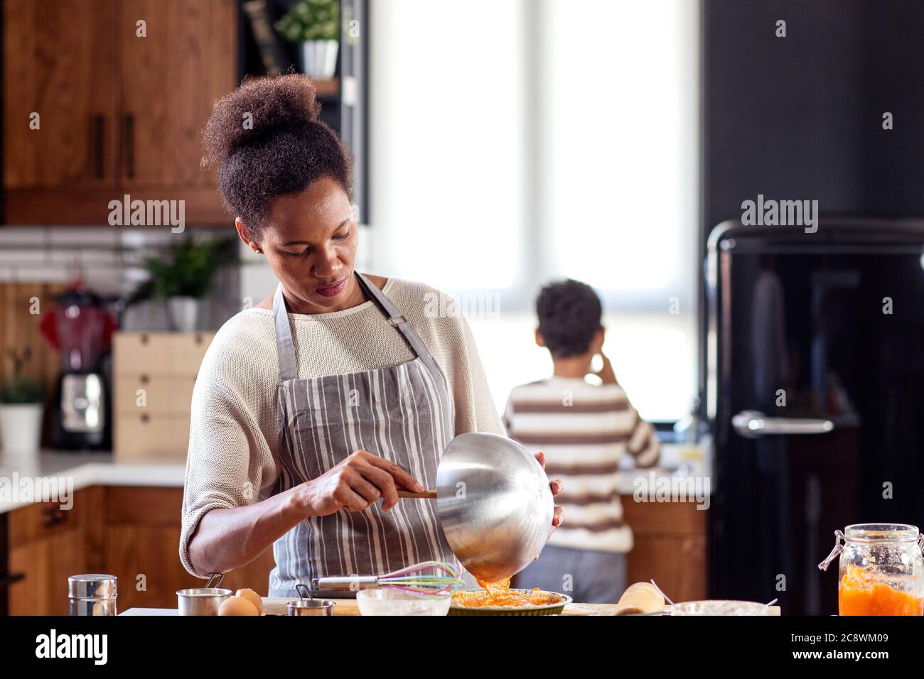 Mum and his son cook in the kitchen Stock Photo - Alamy
