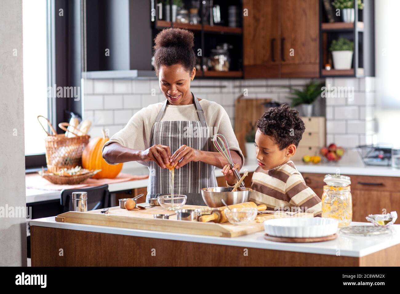 Mum and his son cook in the kitchen Stock Photo - Alamy