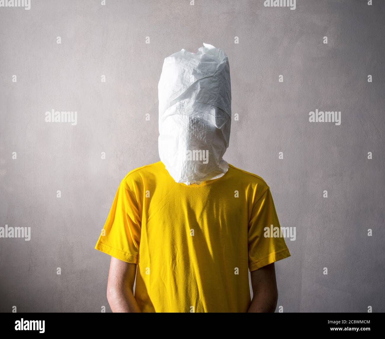a Boy with wrapped around head plastic film Stock Photo - Alamy