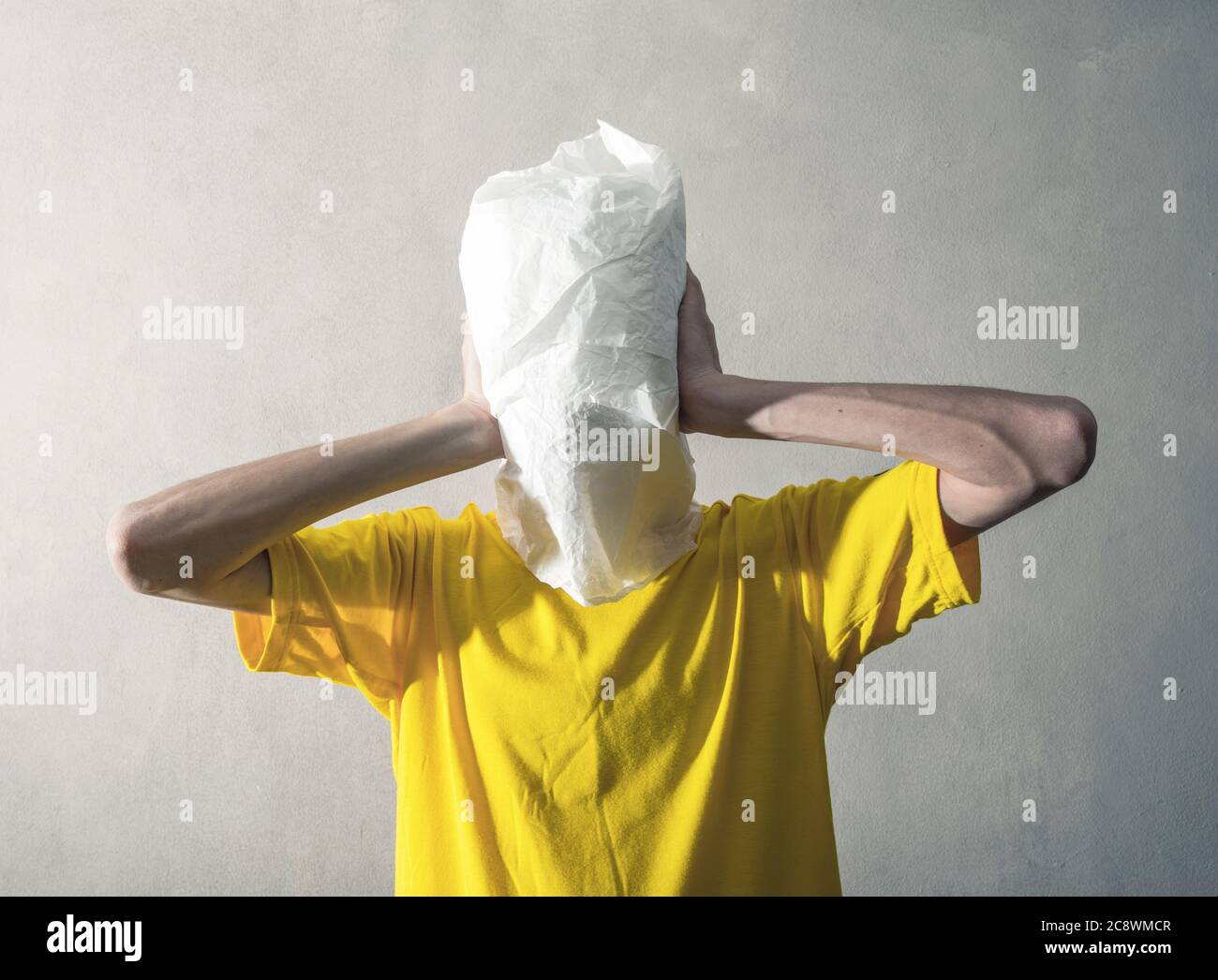 a Boy with wrapped around head plastic film Stock Photo - Alamy