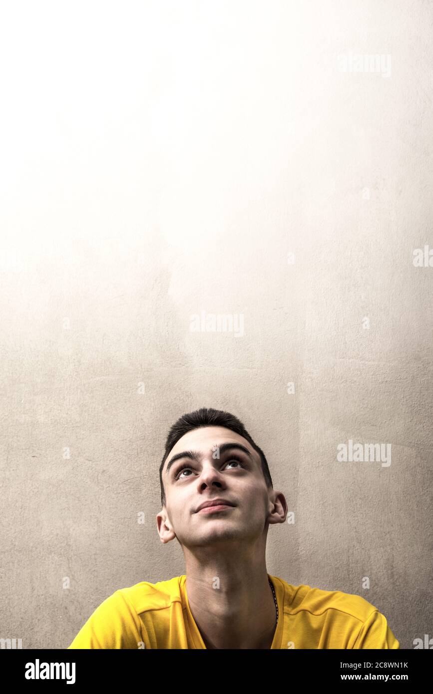 a Young man looking up Stock Photo - Alamy