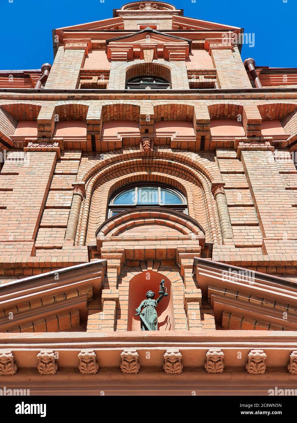 Old courthouse with red brick with statue Stock Photo - Alamy