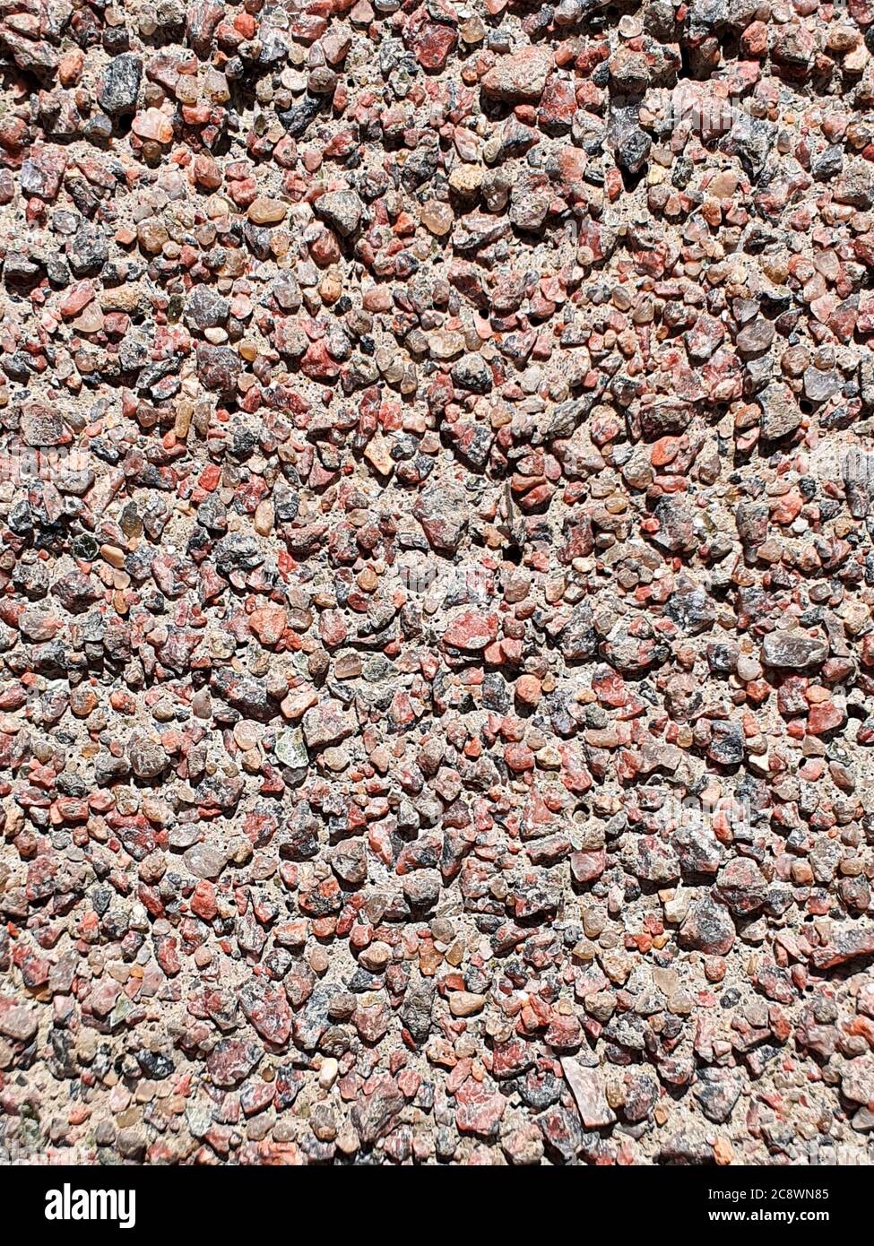 Background wall of red small stone Stock Photo - Alamy