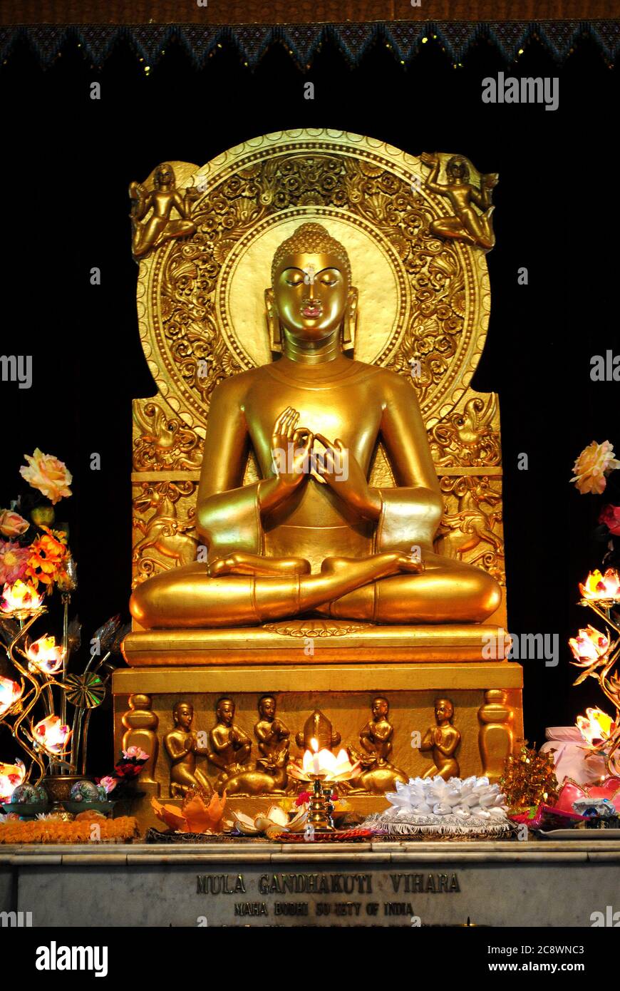 Sitting Golden Buddha statue at a Buddhist temple at Mulagandhakuti ...