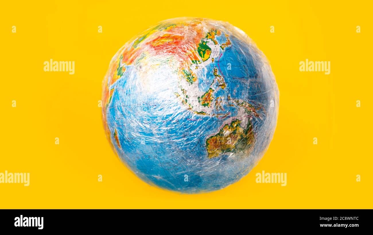 The planet earth is wrapped in plastic. Ecological disaster concept ...