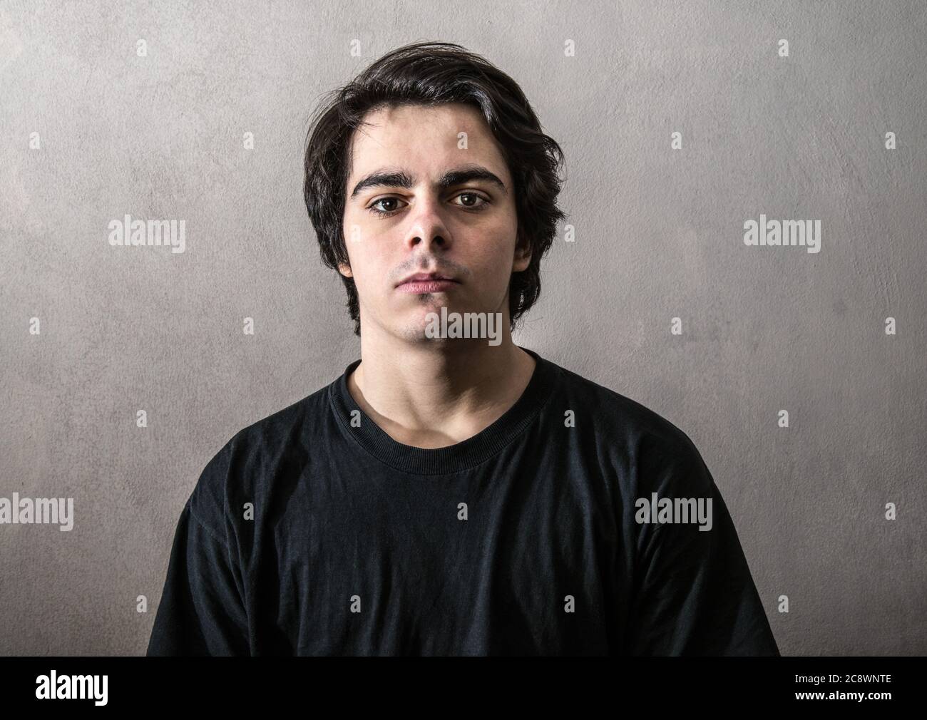 a boy with a serious look Stock Photo - Alamy