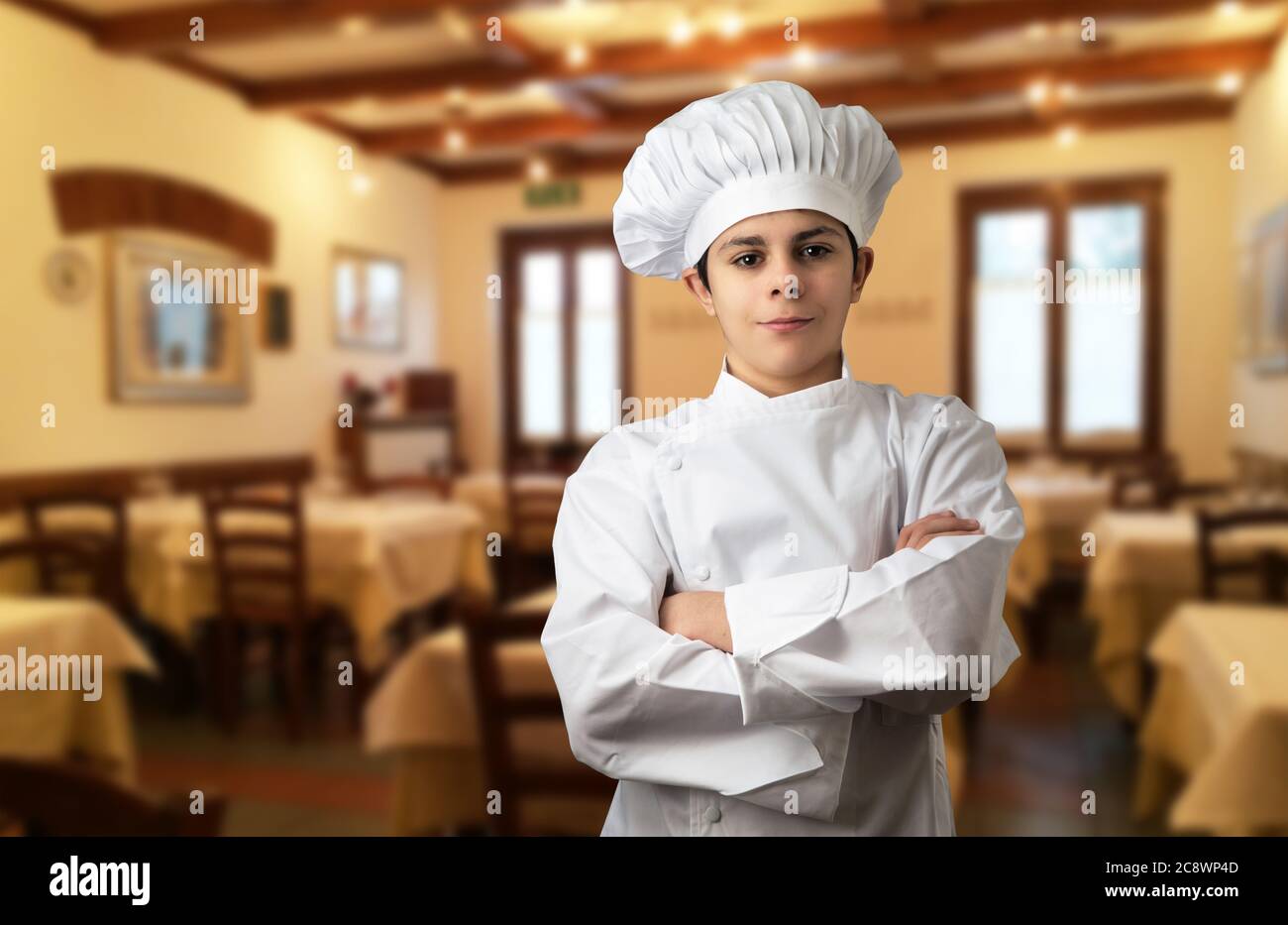 young smiling chef at his restaurant Stock Photo - Alamy
