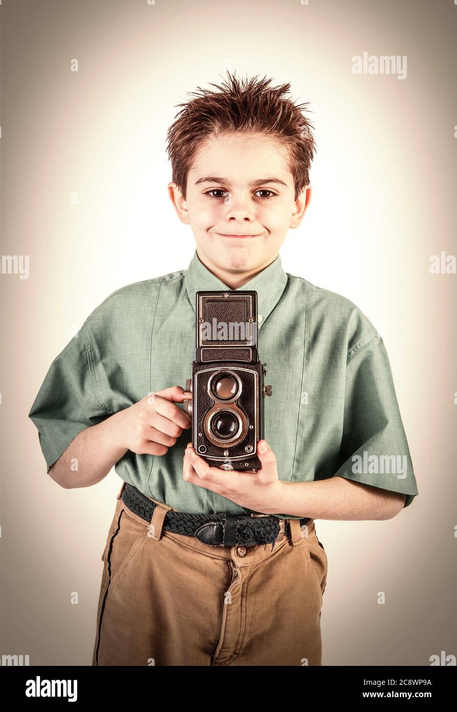 a Little boy with a vintage camera Stock Photo - Alamy