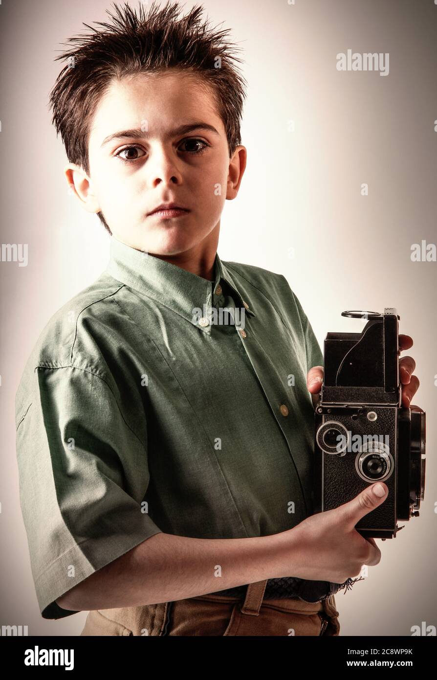 a Little boy with a vintage camera Stock Photo - Alamy