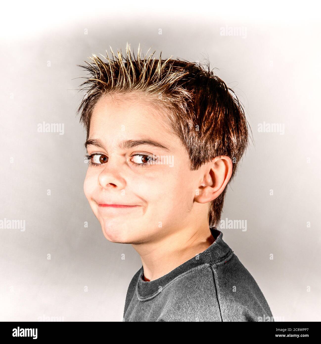 Smiling little boy with peaceful look Stock Photo - Alamy