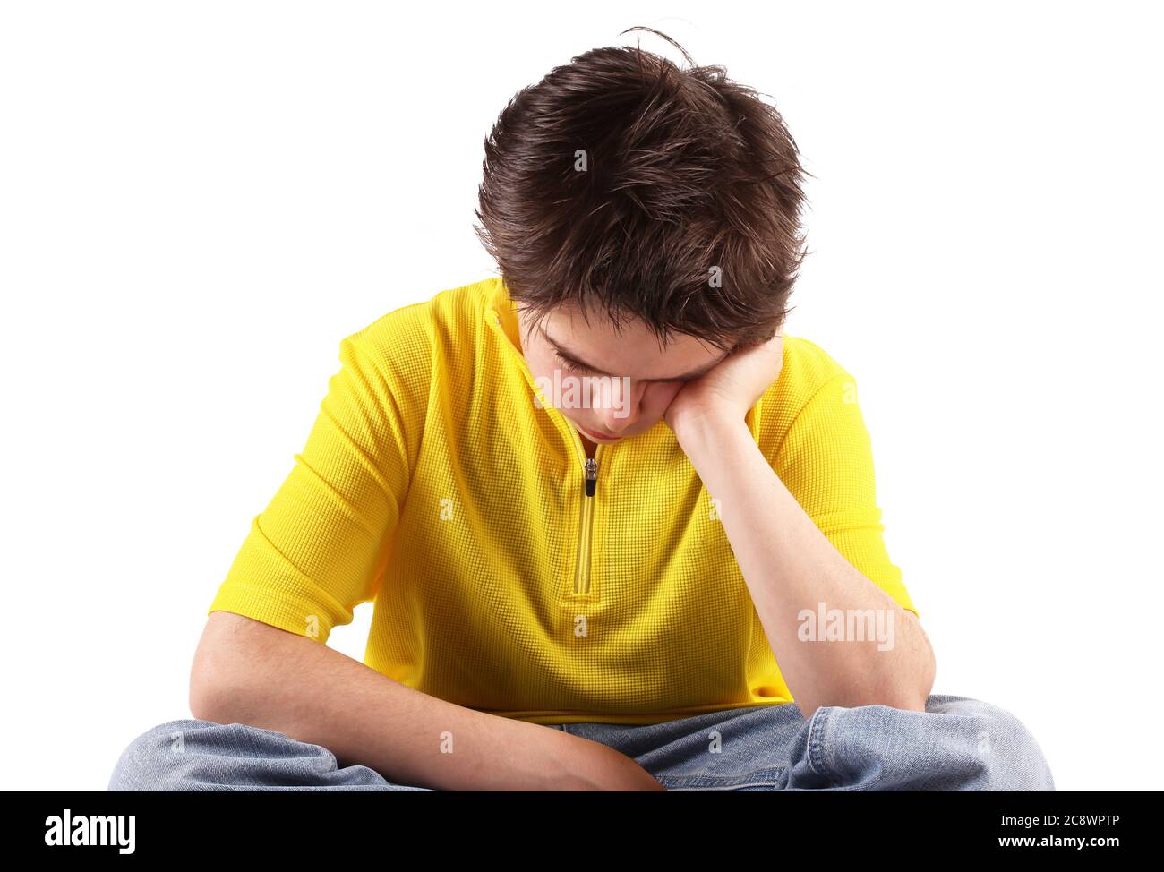 a sad little boy on white background Stock Photo - Alamy