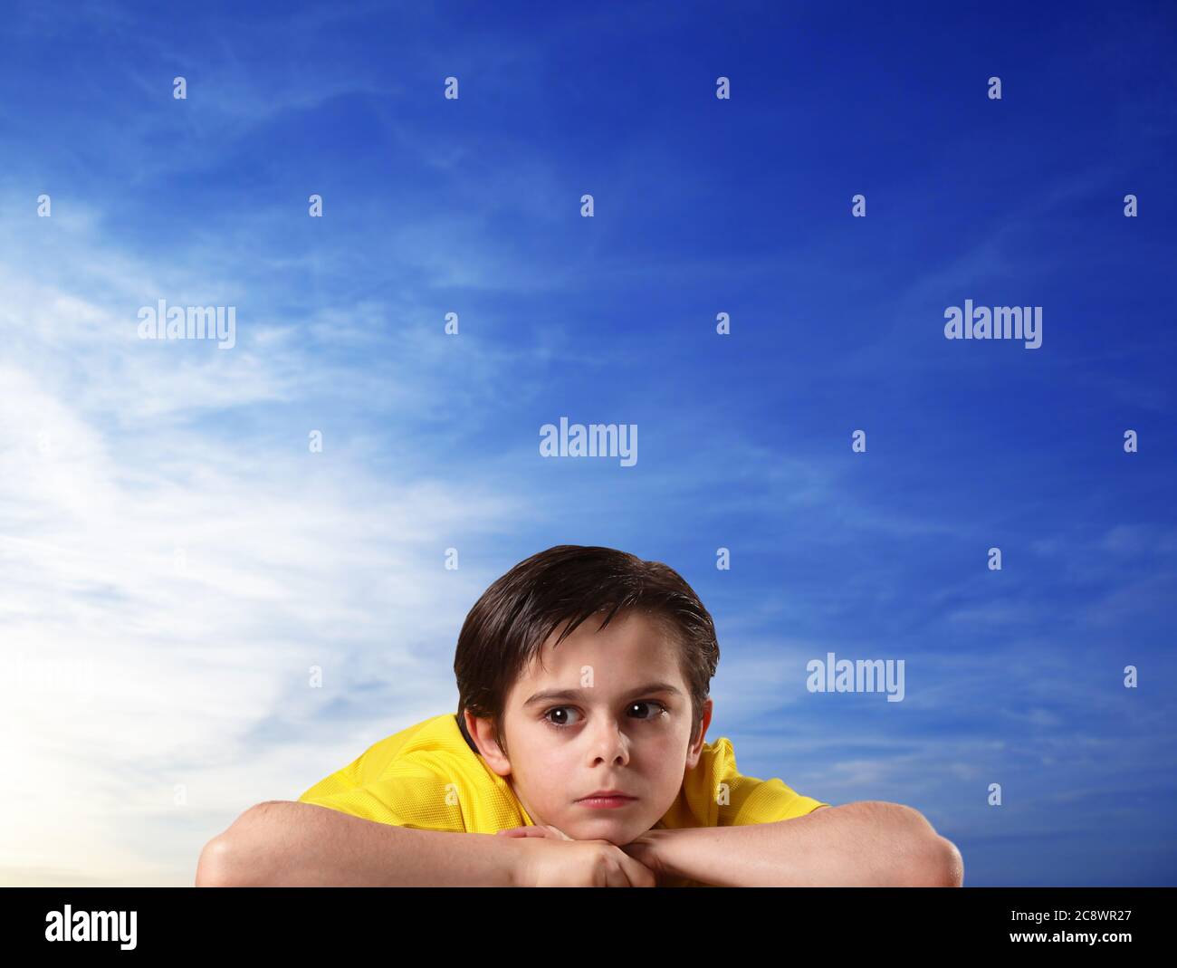 Thoughtful kids on sky background Stock Photo - Alamy