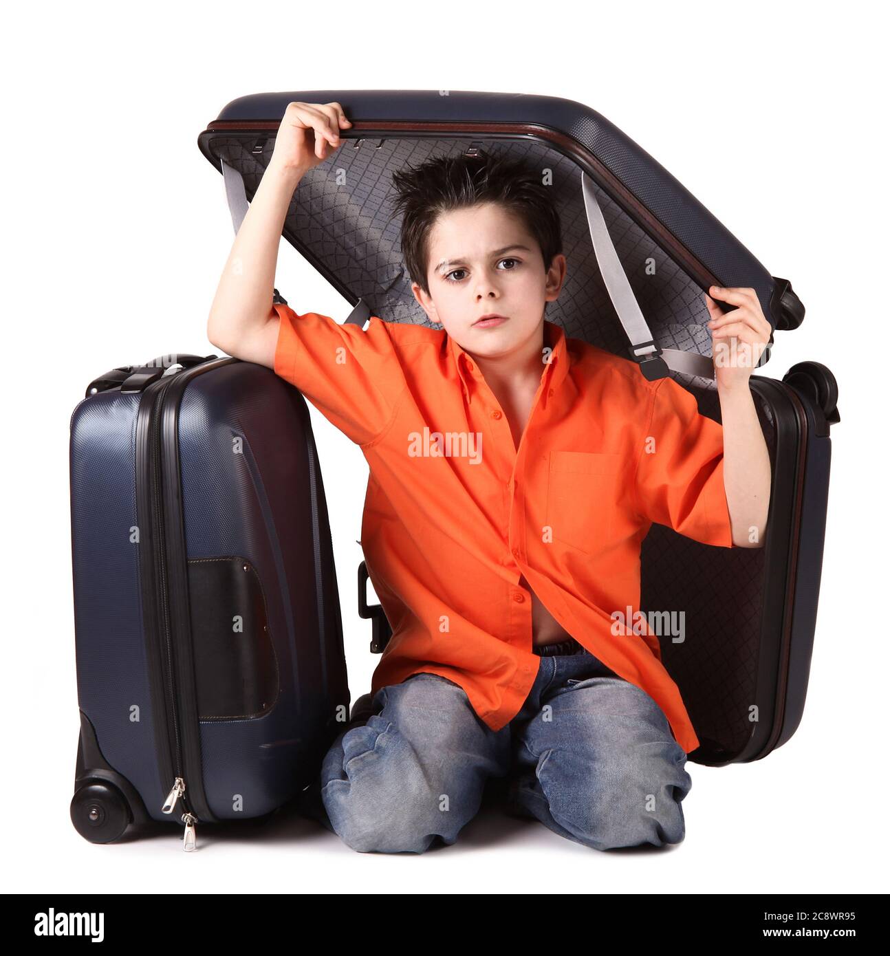 Little boy with suitcase on white background Stock Photo - Alamy