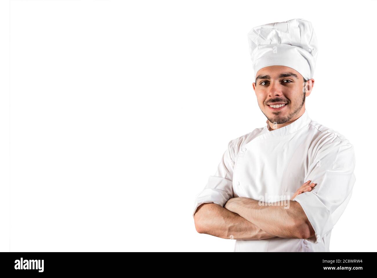 Young smiling chef on white background Stock Photo - Alamy