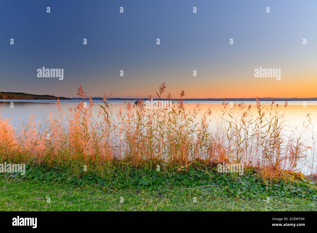 Sunset over Tuggerah Lake from Canton Beach on the Central Coast of NSW ...