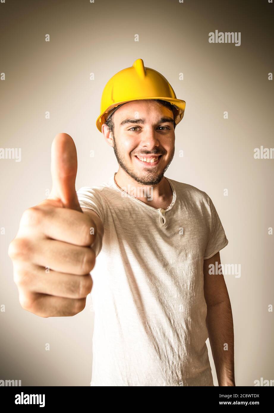 an young smiling worker Stock Photo - Alamy