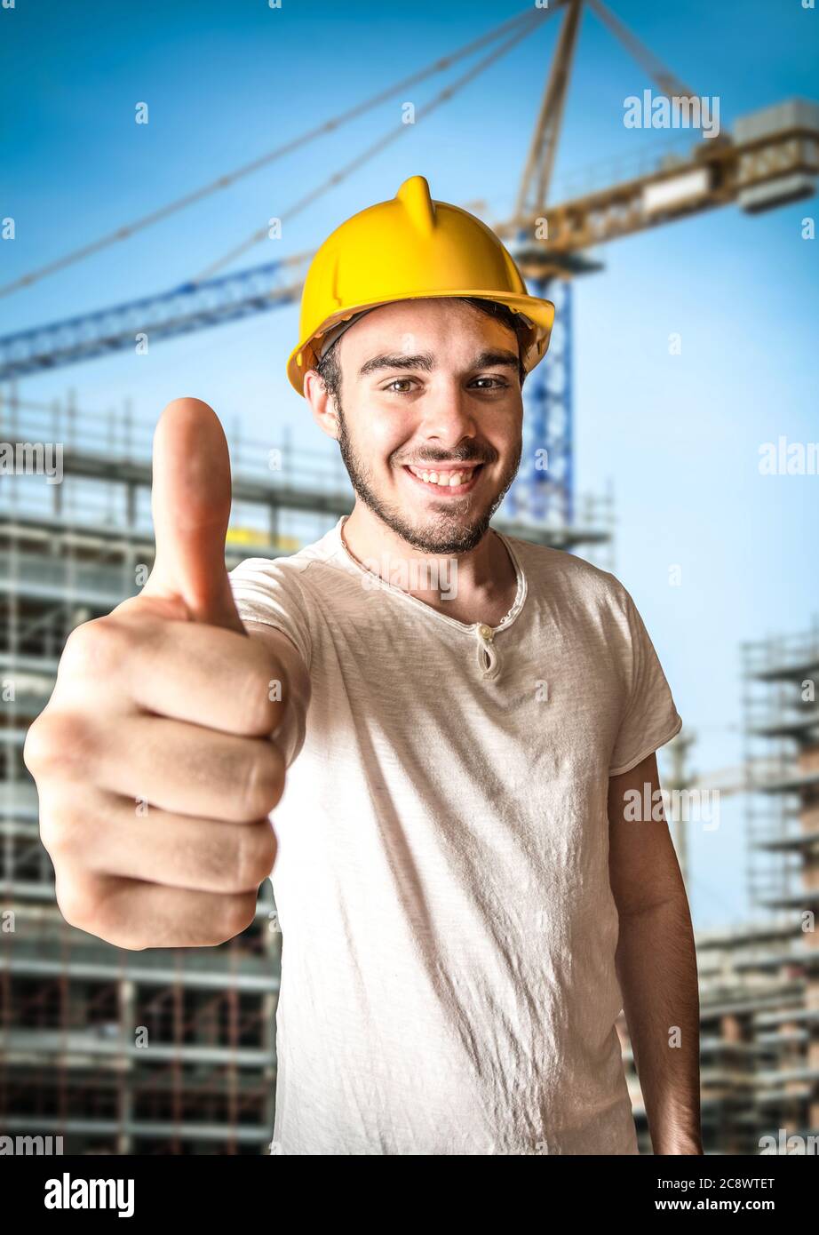 an young smiling worker Stock Photo - Alamy