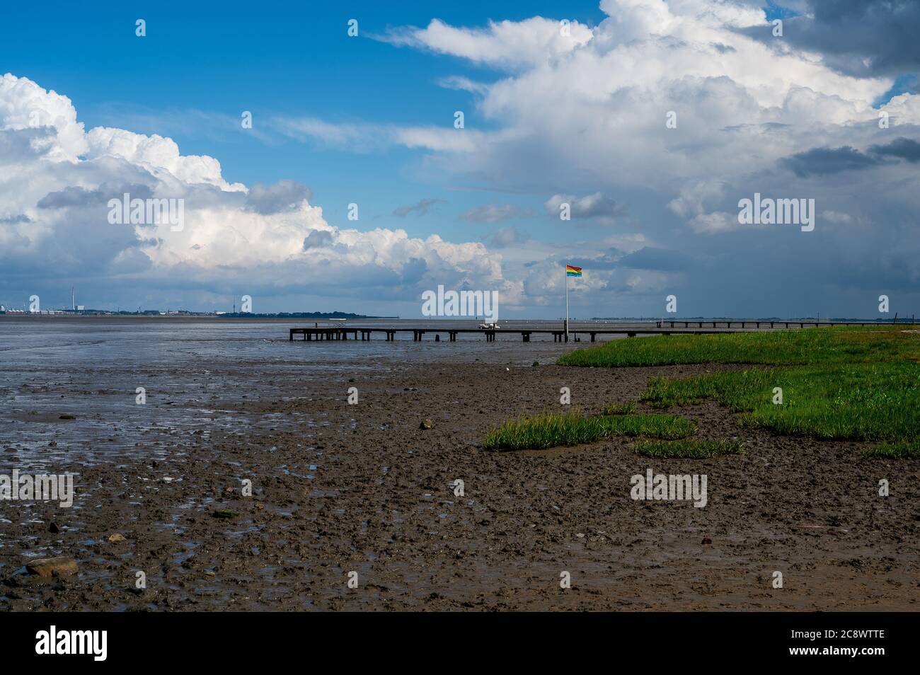 a rainbow flag on a jetty in the wadden sea Stock Photo - Alamy