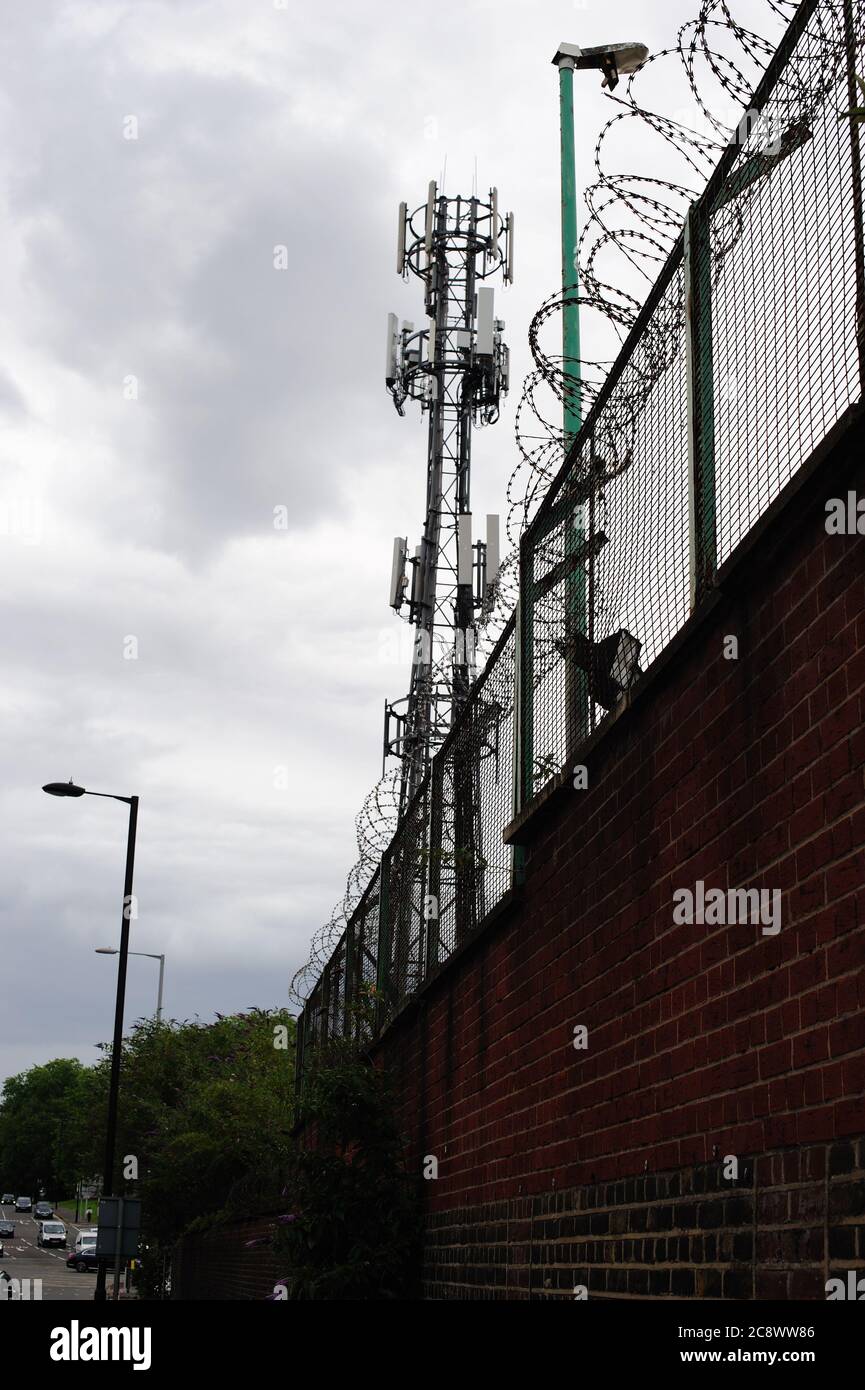 Mobile Phone mast & razor wire Stock Photo - Alamy