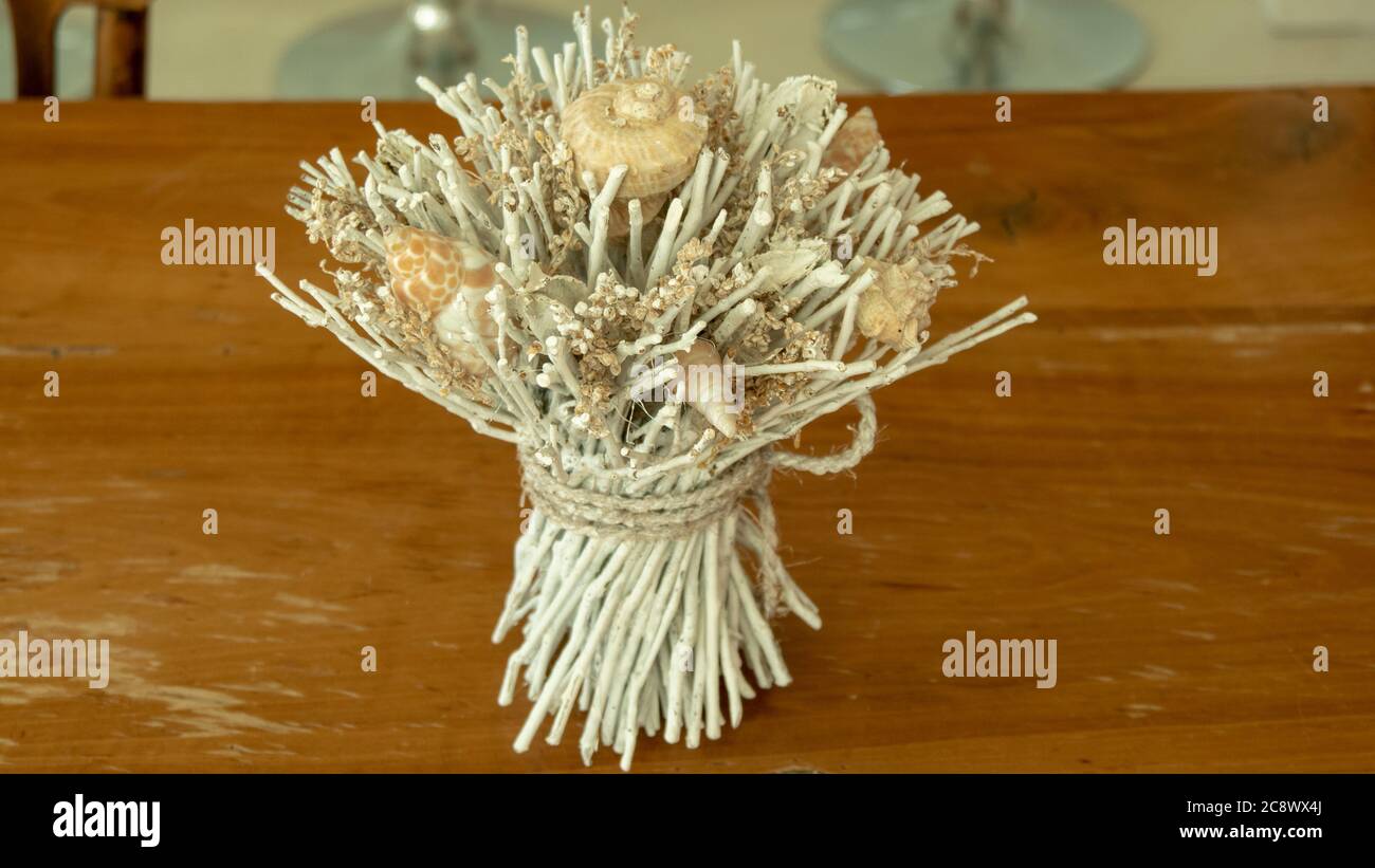 Bouquet of Dried Twigs and Shells on Wooden Table Surface Stock Photo ...