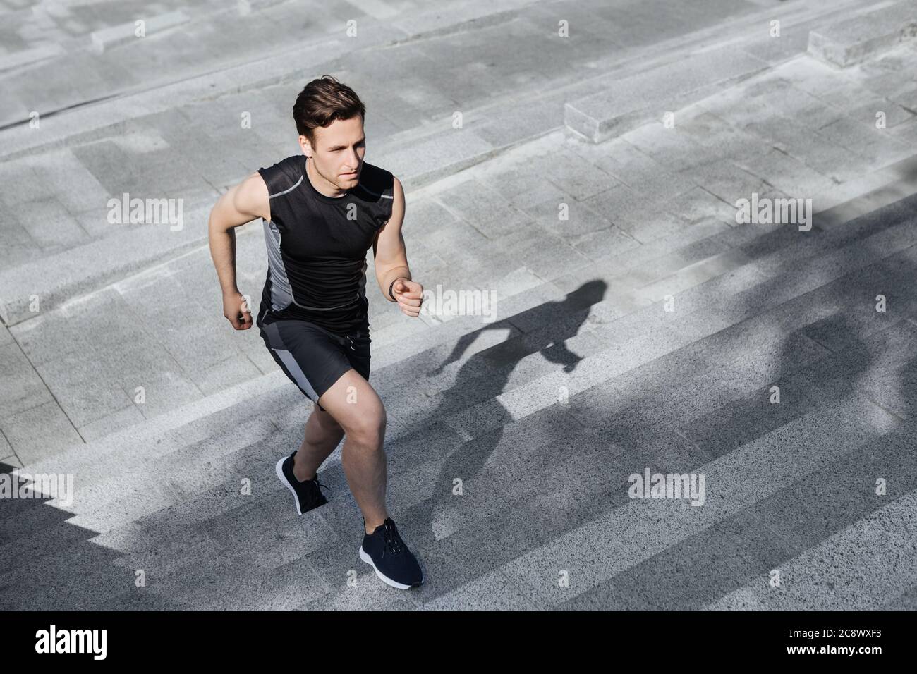 Man running up stairs hi-res stock photography and images - Alamy