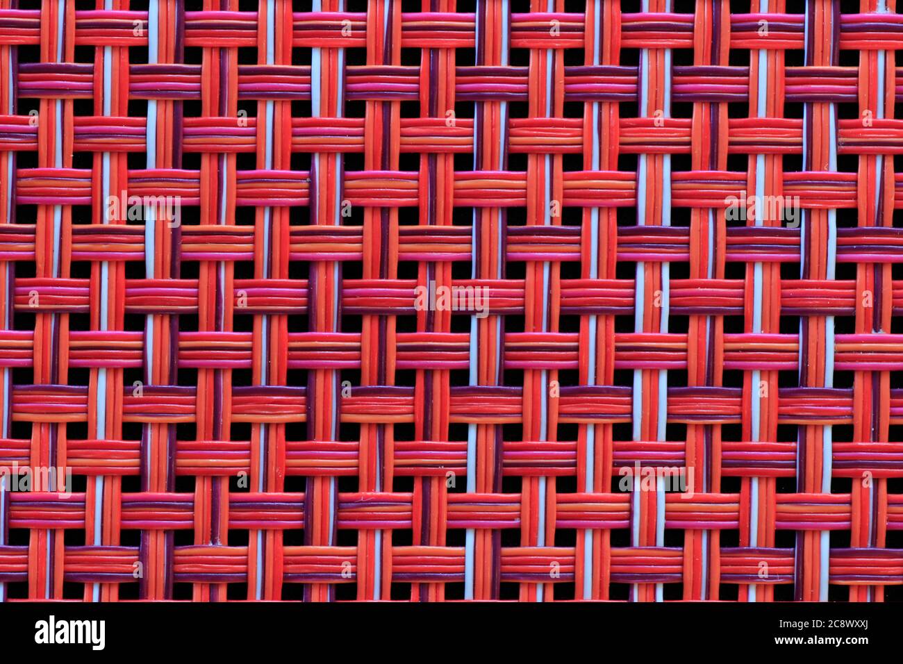 Vivid red basket weave mesh texture background Stock Photo - Alamy