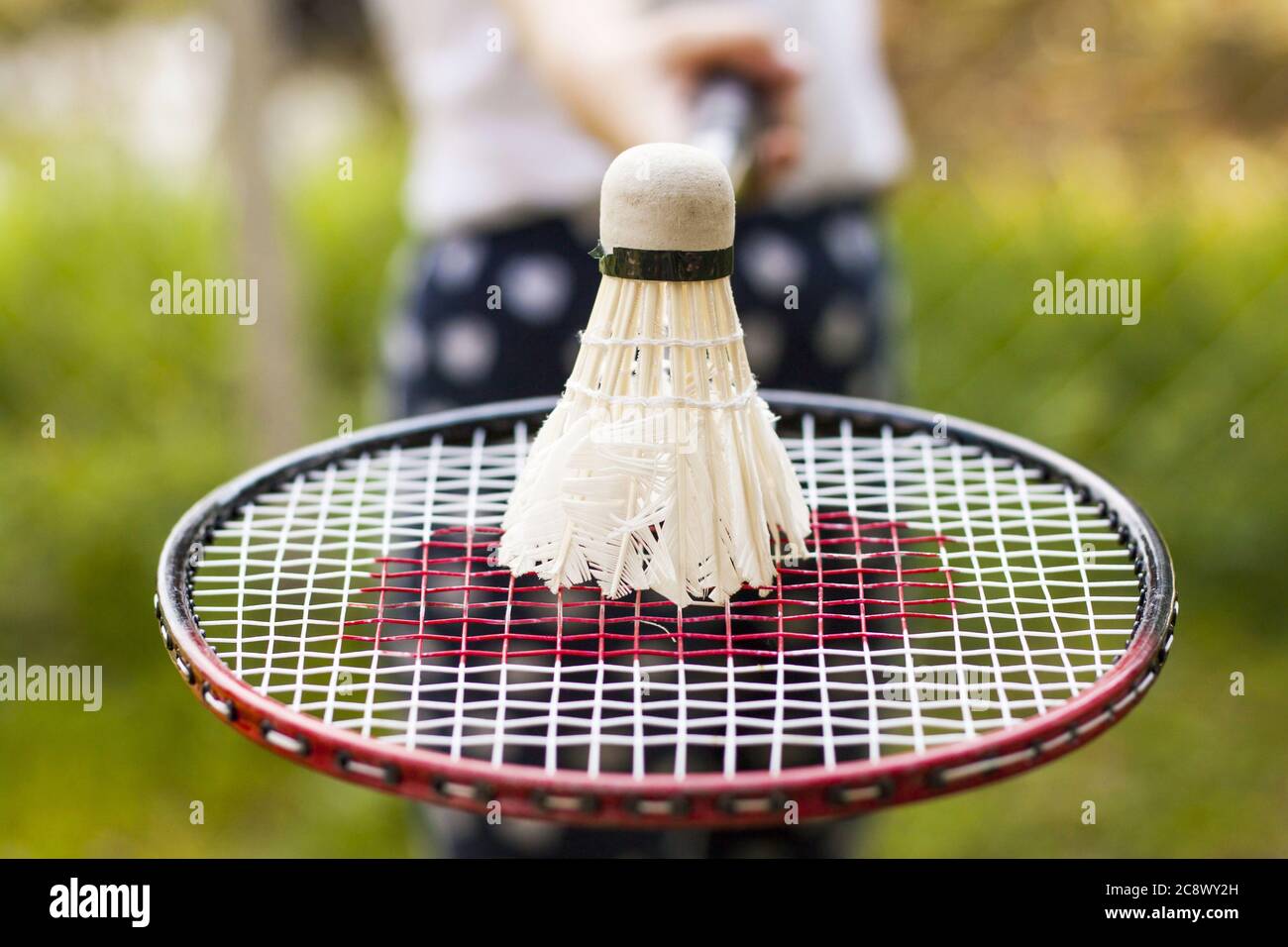 Selective focus shot of a shuttlecock on badminton racket - sport ...