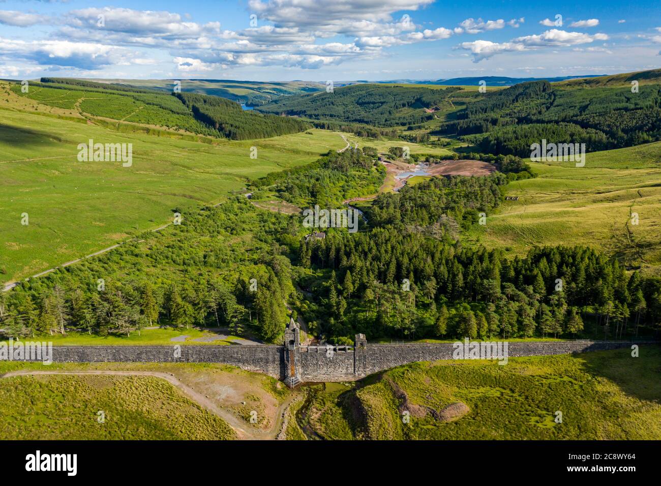 Aerial view of an empty reservoir with old dam wall (Upper Neuadd ...