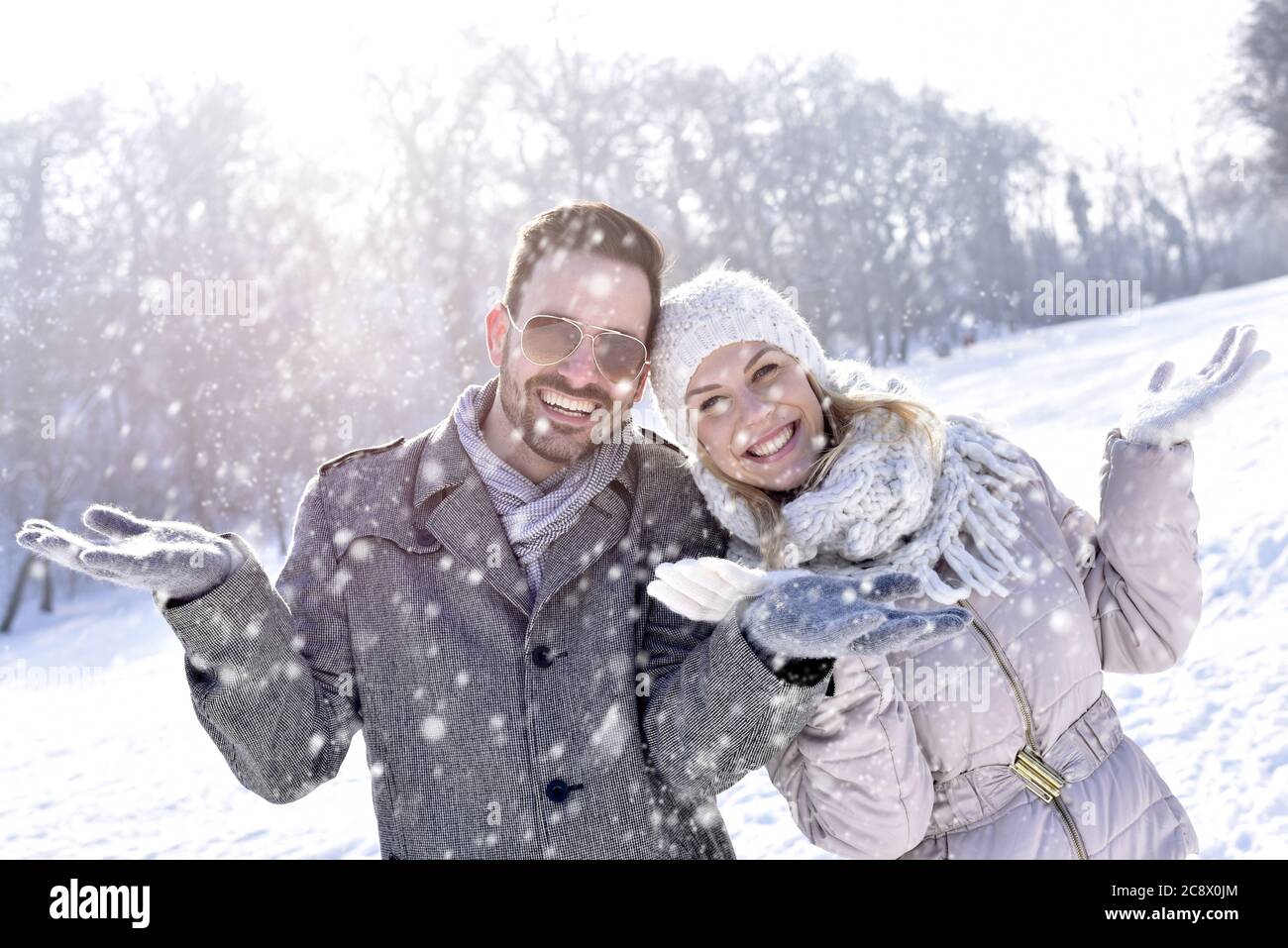 Young attractive smiling and posing in winter wonderland park during ...
