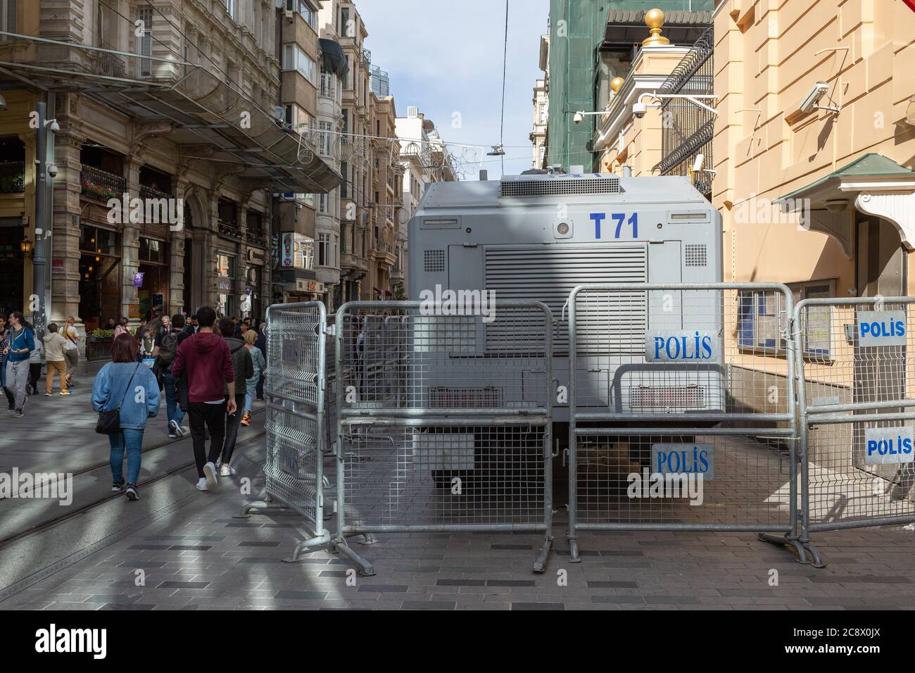 Rear view of armored police vehicle with road blocks in Istiklal Street ...