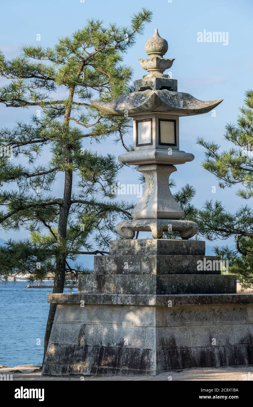 Old stone statue in Japan Stock Photo - Alamy