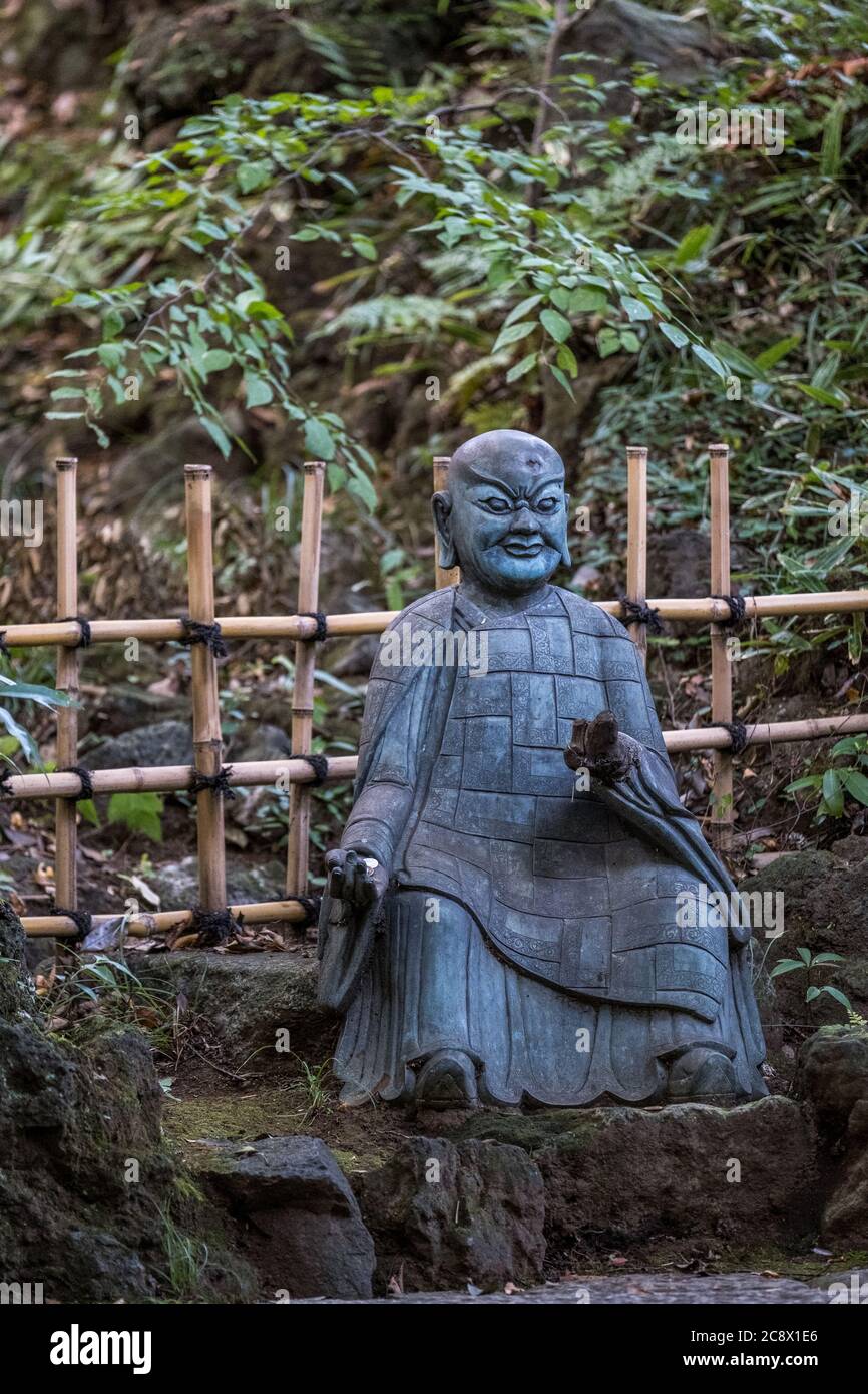 Old stone statue in Japan Stock Photo - Alamy