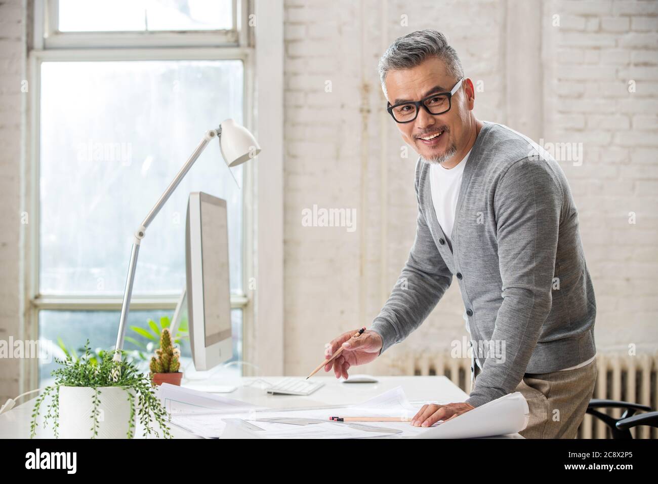 Senior designer portrait painting drawing Stock Photo - Alamy