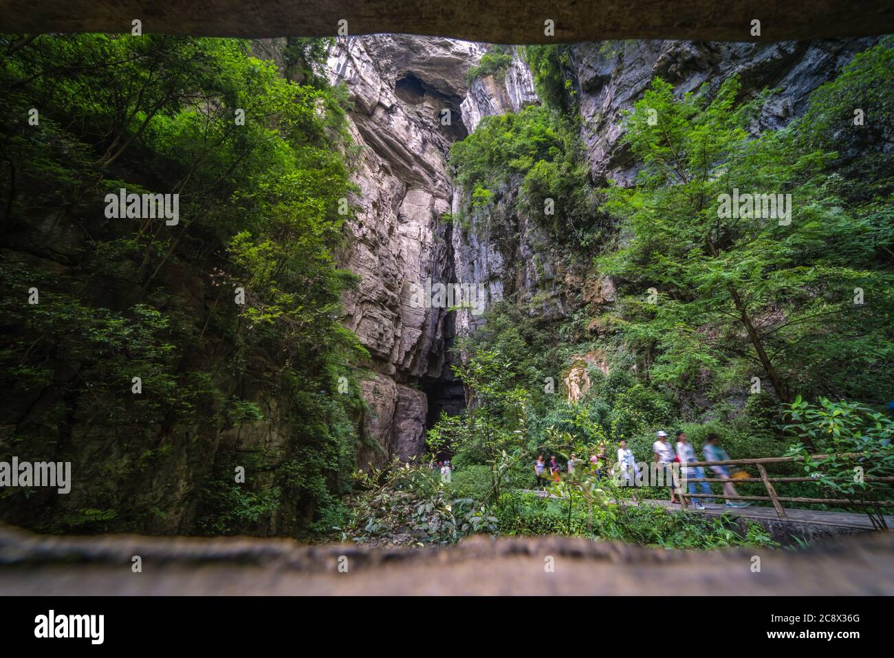 Tourists walking on a sightseeing walking path going through the ...