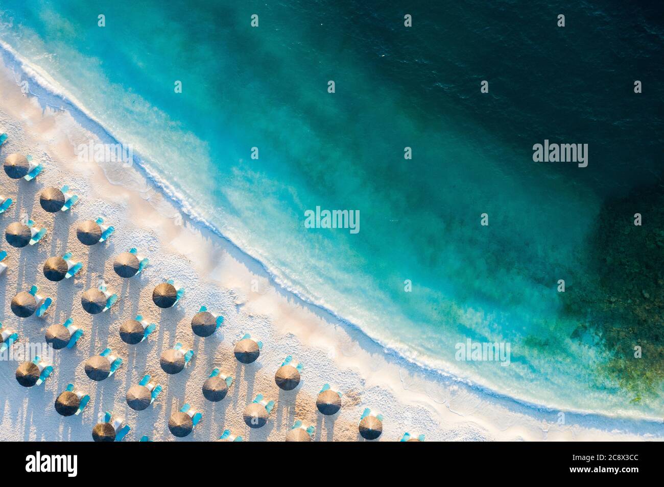 Aerial view of Marble beach. The most beautiful white beach in Greece ...