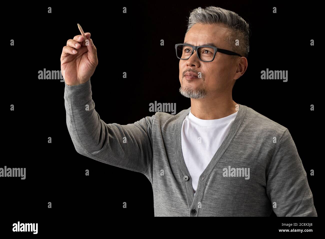 Senior designer with a pencil Stock Photo - Alamy