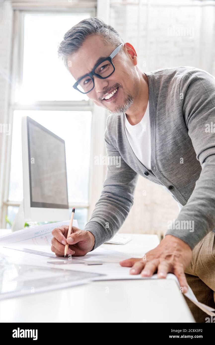 Senior designer portrait painting drawing Stock Photo - Alamy