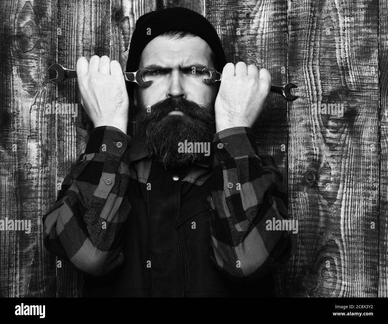 Bearded man, long beard. Brutal caucasian mechanic, unshaven hipster in ...