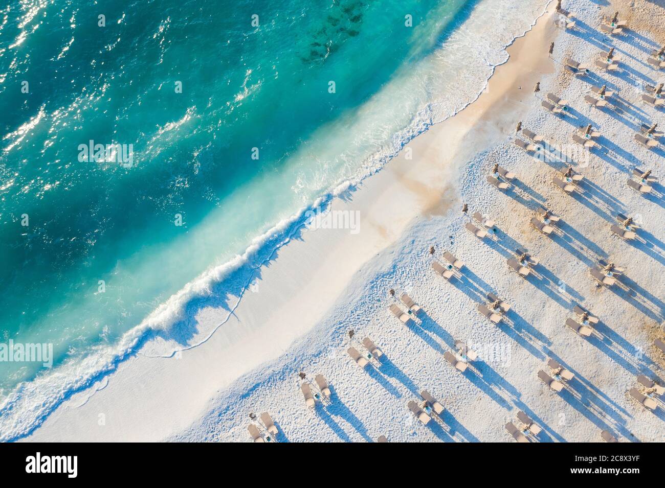 Aerial view of Marble beach. The most beautiful white beach in Greece ...