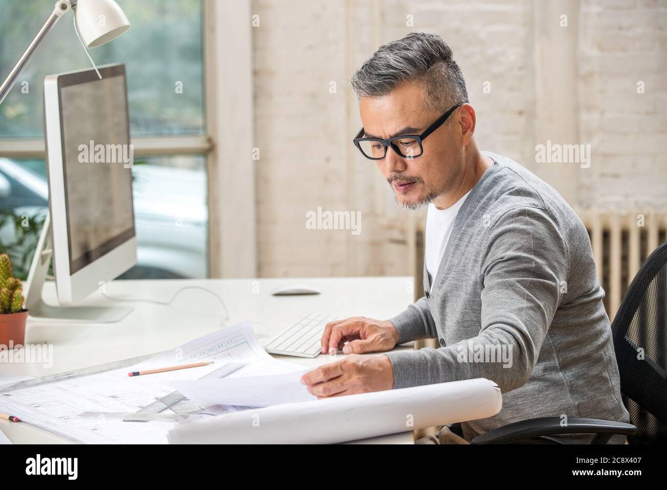 See drawings, a senior designer Stock Photo - Alamy
