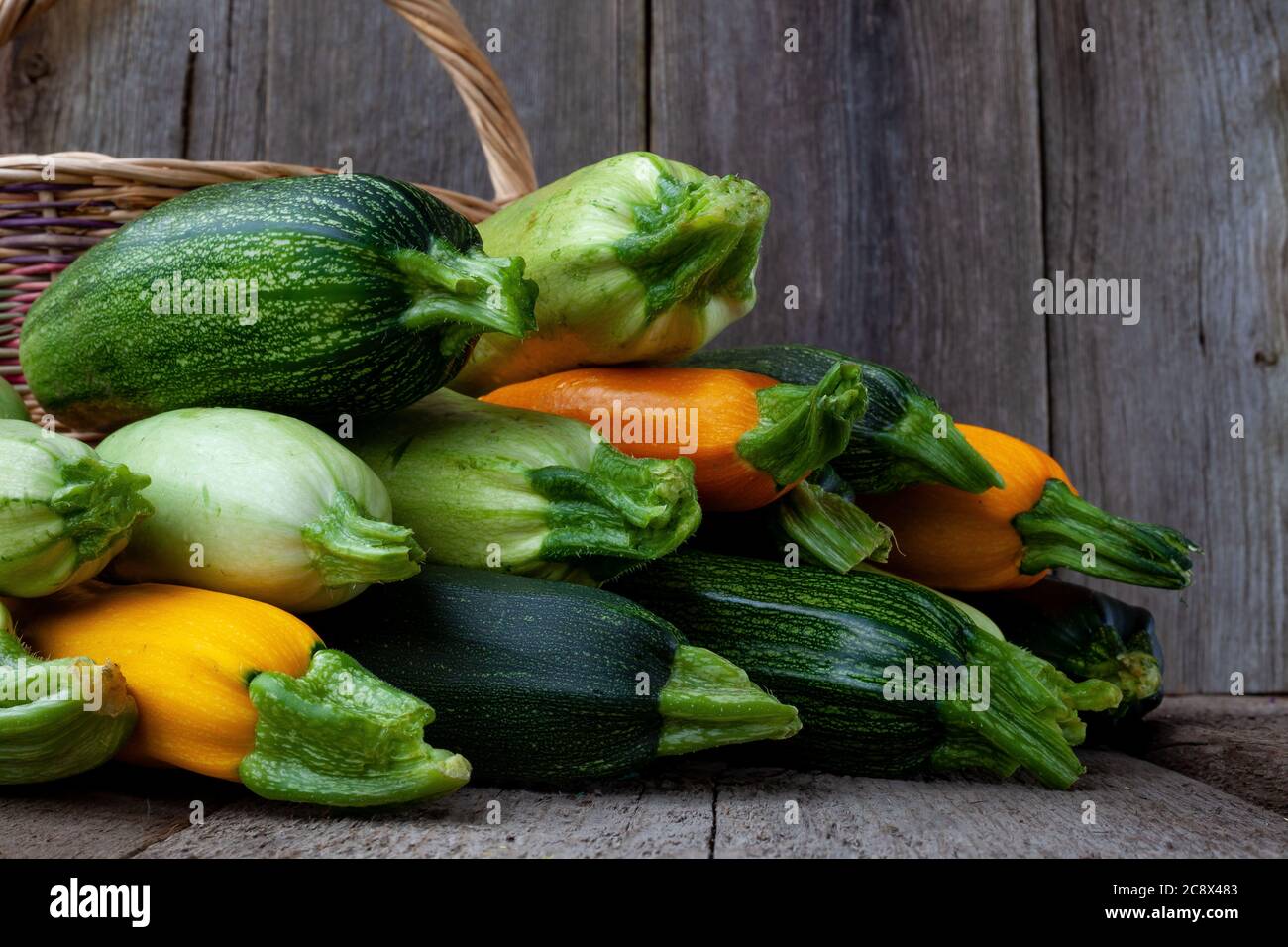 A set of multi-colored zucchini yellow, green, white, orange on the ...