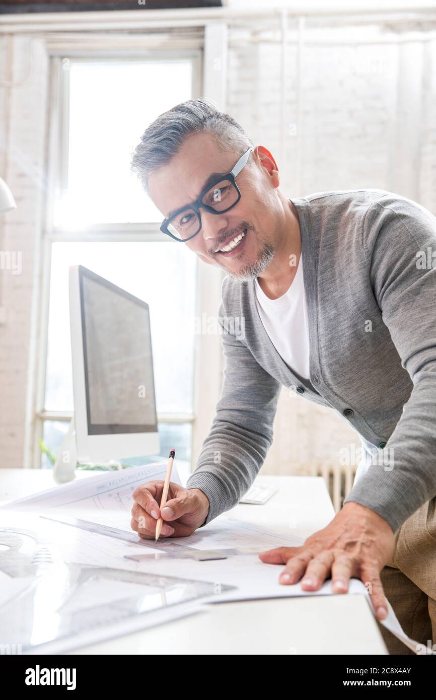 Senior designer portrait painting drawing Stock Photo - Alamy