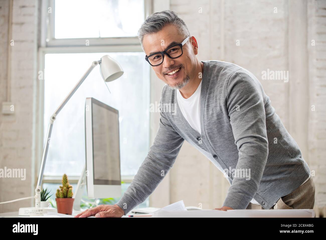Senior designer portrait painting drawing Stock Photo - Alamy
