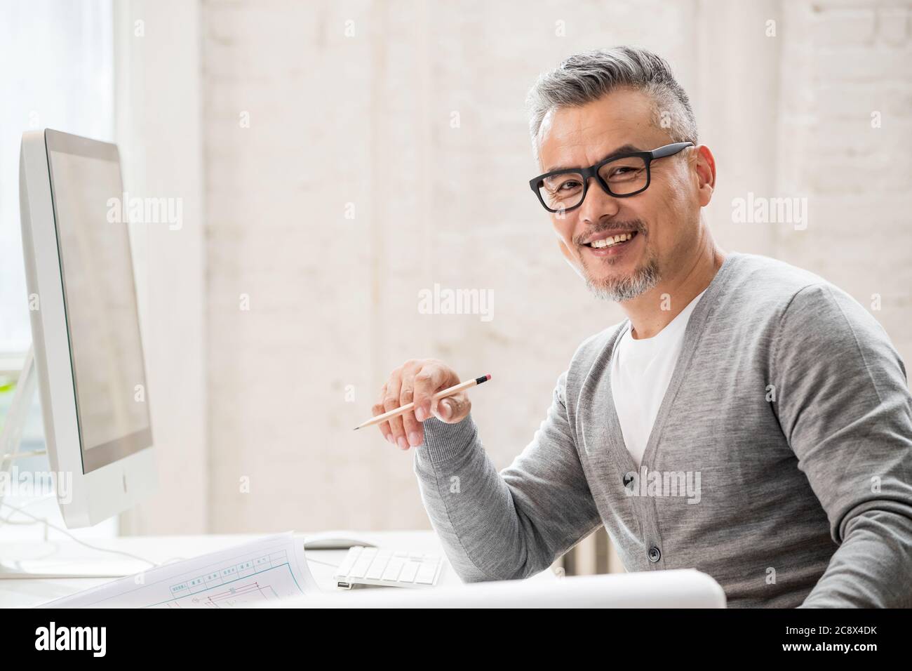 Indoor senior designers office image Stock Photo - Alamy