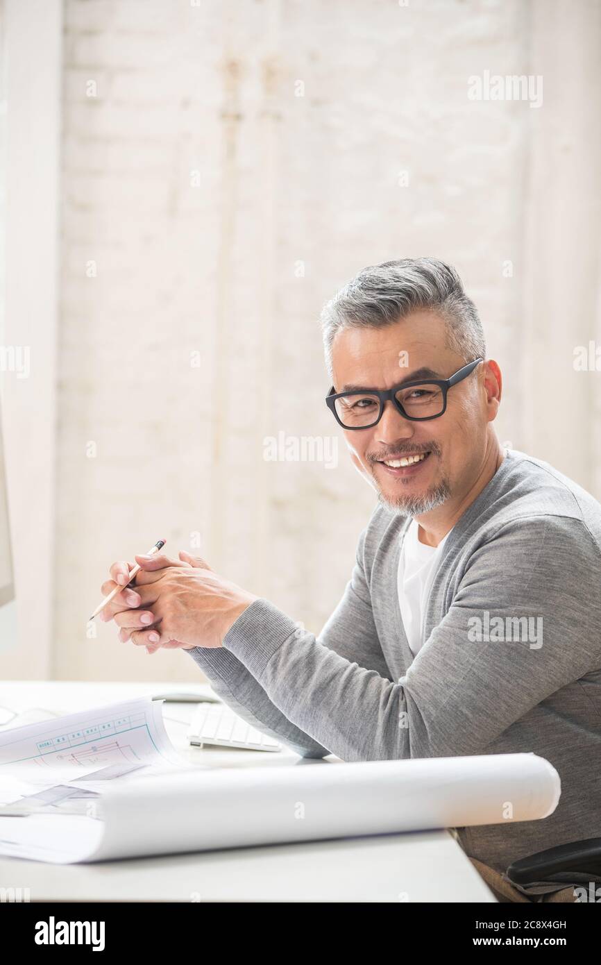 Indoor senior designers office image Stock Photo - Alamy