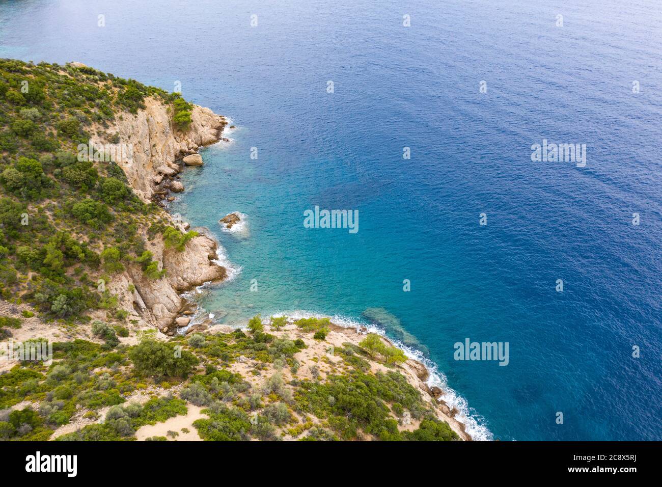 Aerial view of waves, rocks and transparent sea in Greece. Abstract ...