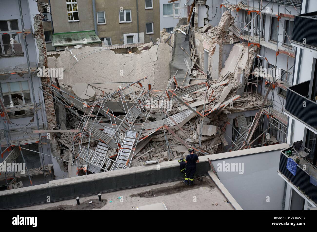 Duesseldorf, Germany. 27th July, 2020. Firefighters stand in front of ...
